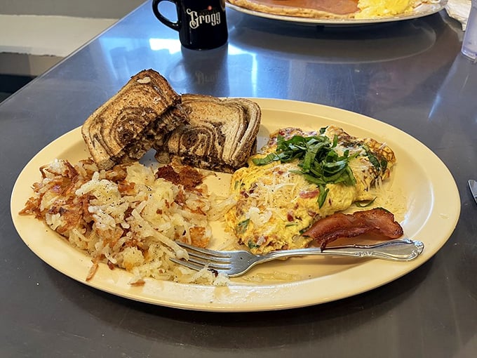 An omelet should be a canvas for creativity, and this one—dotted with fresh green onions—is practically breakfast Picasso.