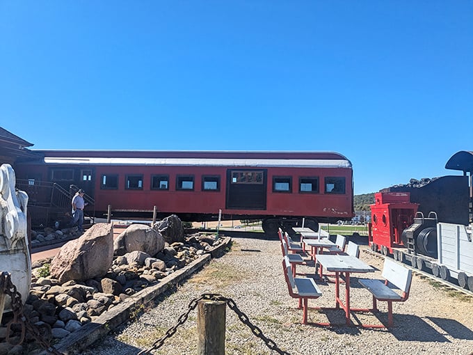 Picnic tables invite visitors to linger and enjoy the surreal experience of dining in the shadow of a giant nodding chef.