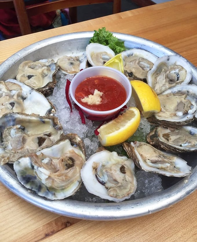 A dozen glistening oysters on ice – nature's perfect appetizer and the ocean's way of saying "you're welcome" to your taste buds.