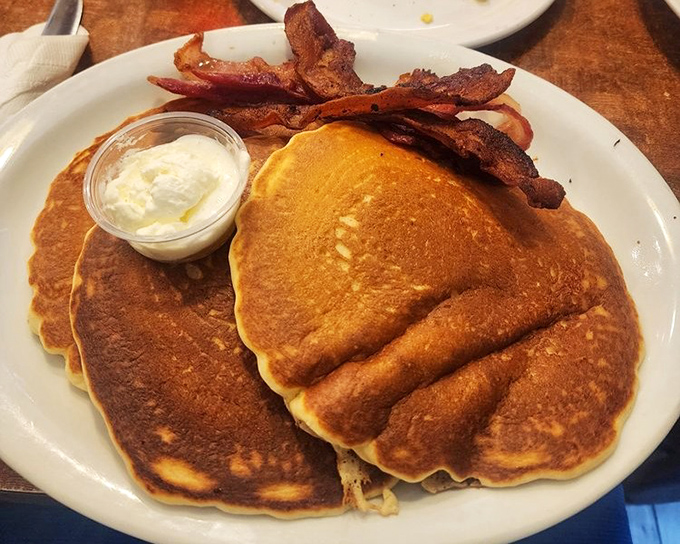 Golden pancakes with a side of perfectly crisped bacon—the breakfast equivalent of winning the lottery before you've had your coffee.