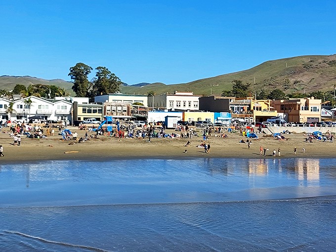 Beach day perfection—where the town serves as backdrop to nature's greatest show and everyone gets front-row seats.