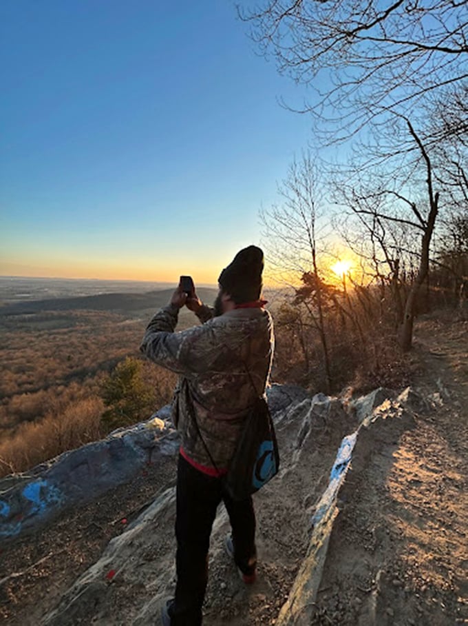 Finding your perfect perch at sunset – because some moments deserve a rocky throne.