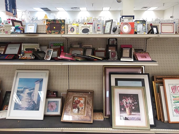 The frame alone is often worth the price—savvy decorators scout this section for quality wood frames, planning to swap in their own art.