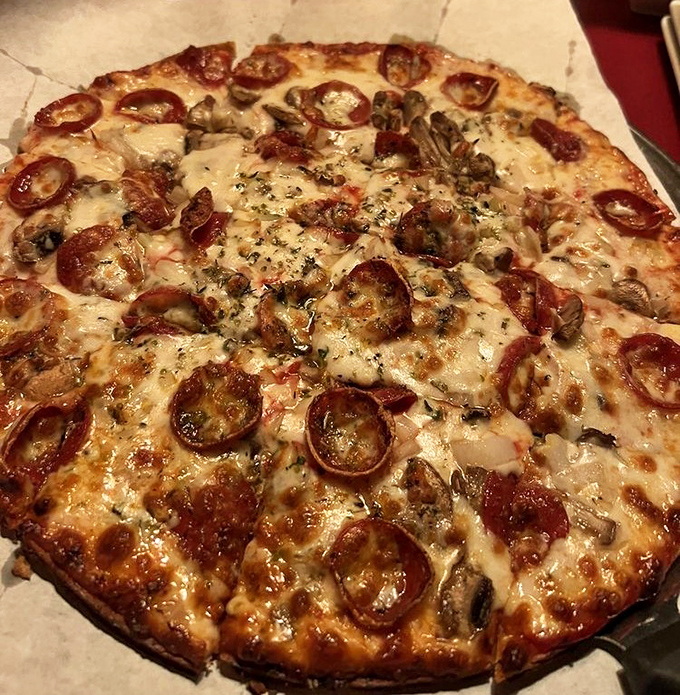 Pizza perfection isn't just about the cheese pull—it's about those perfectly placed pepperoni cups holding tiny pools of flavor like delicious little hot tubs.