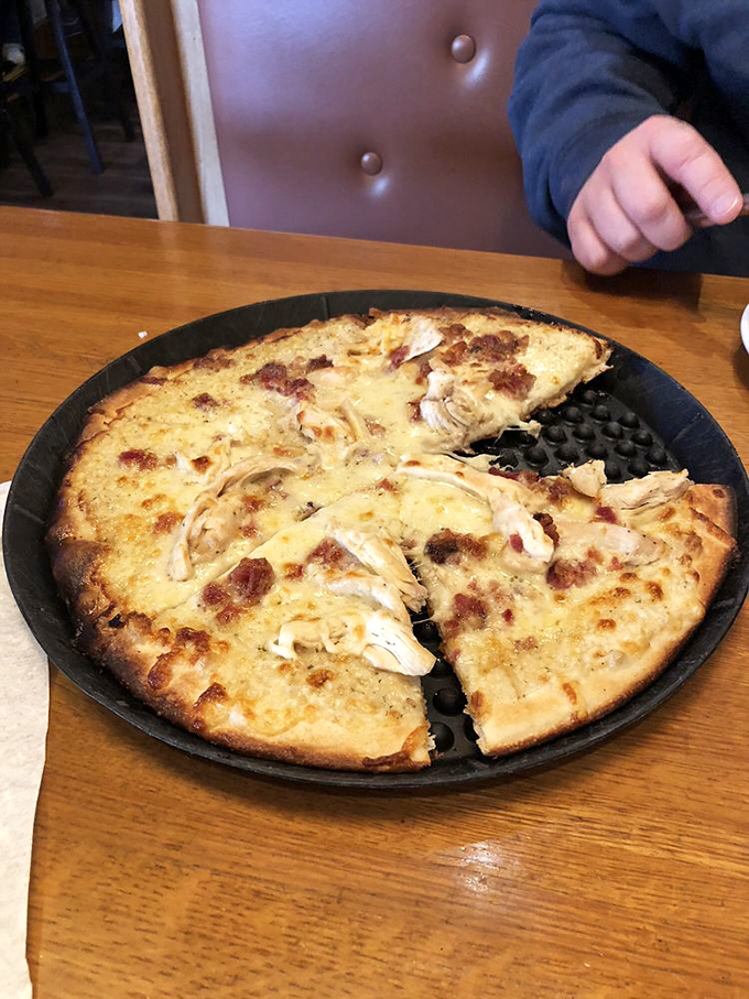 Pizza that's achieved that perfect balance between crispy and chewy. The cheese has melted into such contentment it might be meditating.