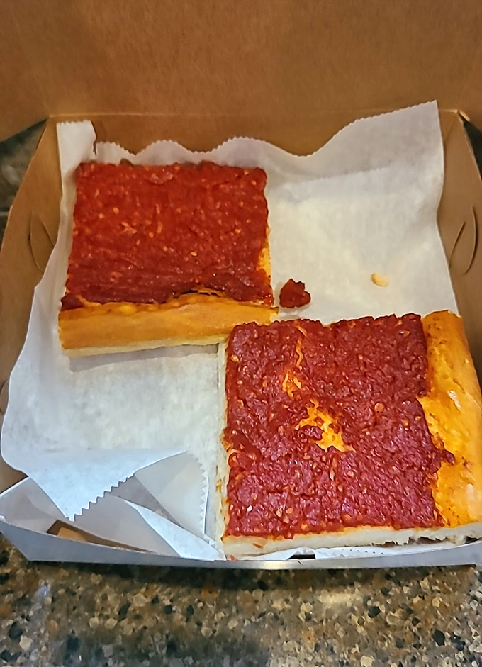Tomato pie that proves simplicity is the ultimate sophistication – thick crust, rich sauce, minimal cheese, maximum flavor.