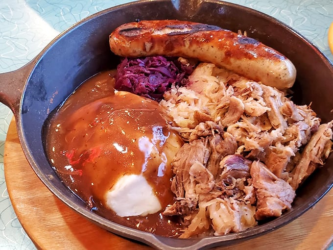 Slow-cooked pulled pork with gravy and a sausage link—because in Ohio, "I'm not that hungry" still means you need protein for three days.