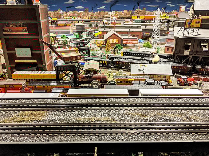 Layers upon layers of miniature life unfold in this industrial scene. It's like peering into a parallel universe where everything runs on time.