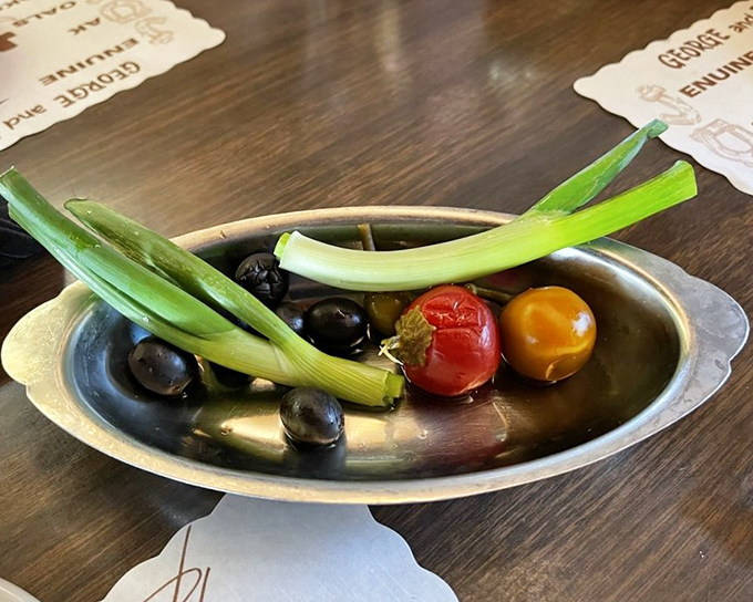 The relish tray—a dying art form worth preserving. Those pickled vegetables aren't just appetizers; they're palate awakeners preparing you for the main event.