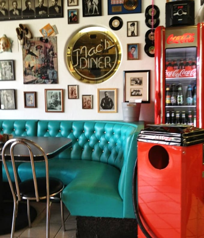 That turquoise booth isn't just seating—it's a front-row ticket to the greatest hits of American diner culture, complete with memorabilia soundtrack.