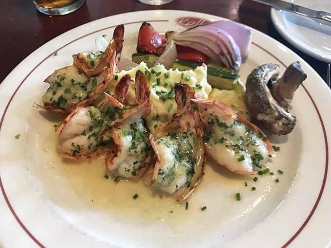 These prawns aren't just cooked—they're pampered in garlic butter until they surrender all their sweet oceanic flavor, accompanied by grilled vegetables that know their supporting role.