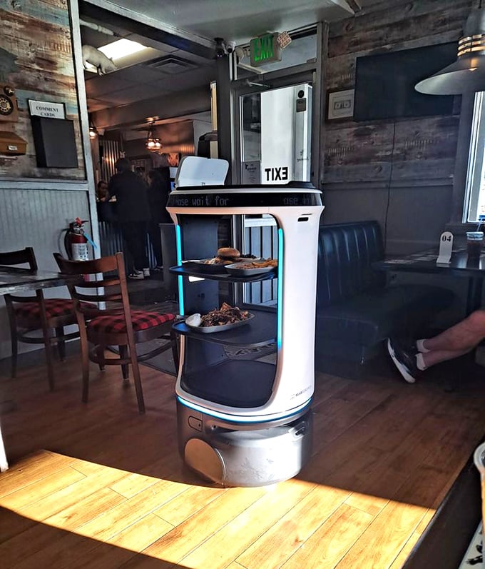 The future of barbecue service has arrived! This robot server delivers smoky goodness without ever complaining about its feet hurting.