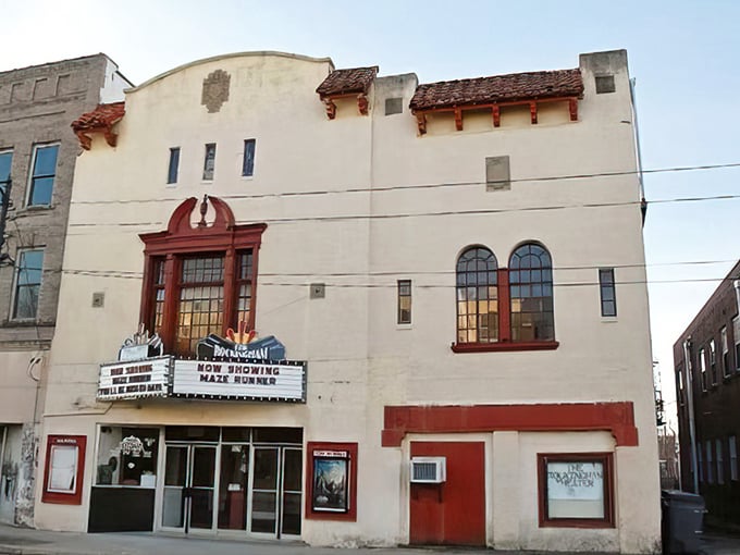 The Rockingham Theatre's vintage marquee promises entertainment the old-fashioned way—no streaming, no buffering, just pure movie magic.