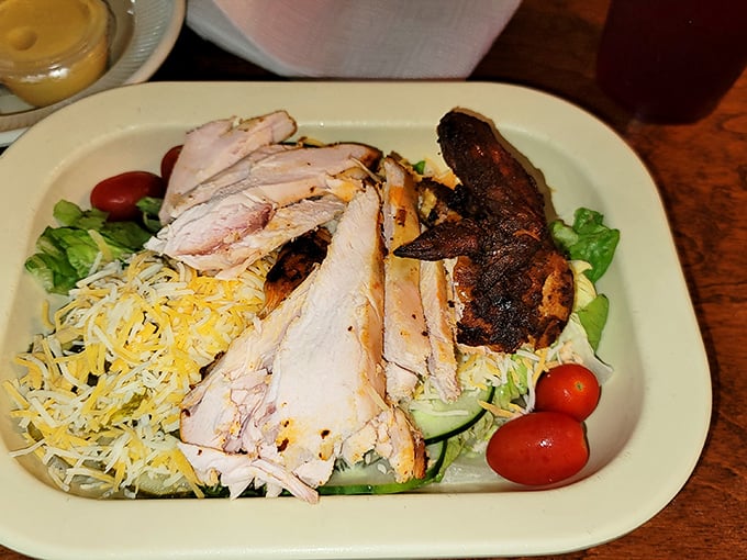 When barbecue meets salad, everybody wins. Smoky protein atop fresh greens—the compromise that doesn't feel like one.