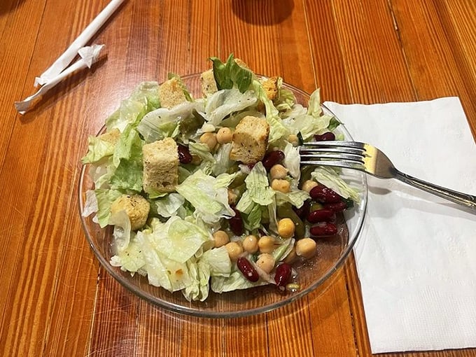 Even the salad has personality here – a garden of greens, beans, and croutons that doesn't feel like punishment.