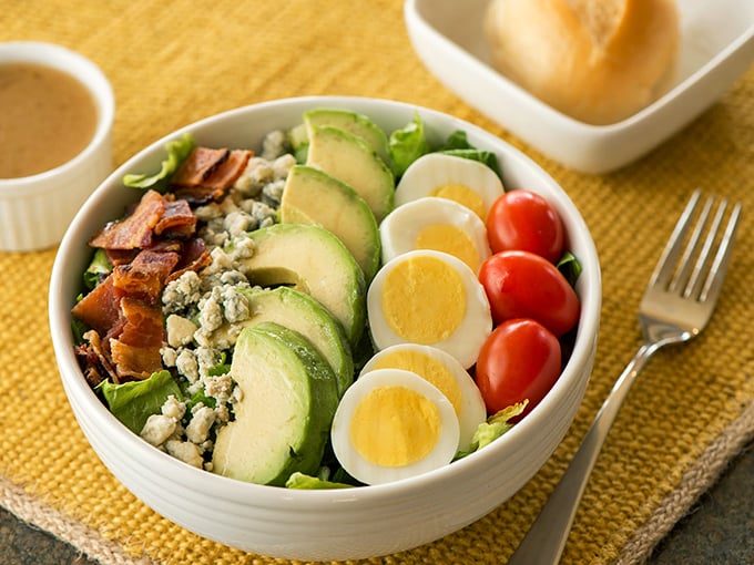This isn't just a salad—it's a colorful composition of avocado, hard-boiled eggs, and tomatoes that somehow makes eating vegetables feel like a reward.