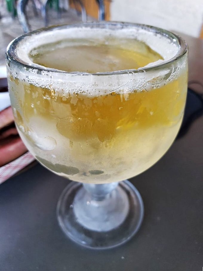 A frosty schooner of golden refreshment—nature's perfect counterbalance to hours of slow-smoked meat.