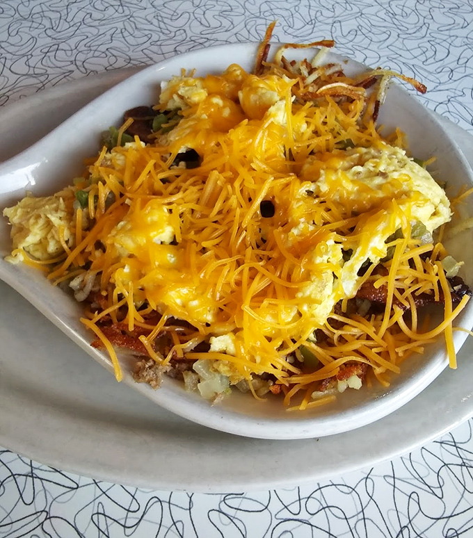 The Sevier Skillet—where breakfast ingredients gather for what appears to be the most delicious family reunion ever held on a plate.