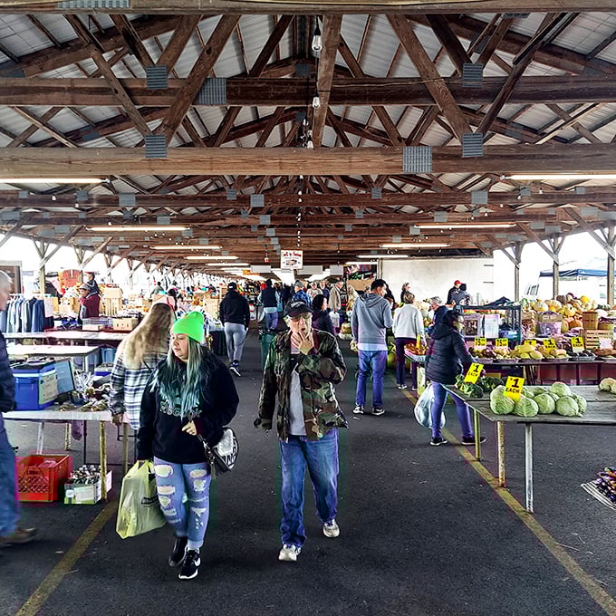 The market's bustling aisles where strangers become temporary shopping companions united in the quest for the perfect produce.