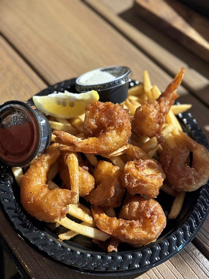 Crispy battered shrimp nestled among golden fries—the kind of comfort food that makes you want to hug the chef and the ocean.