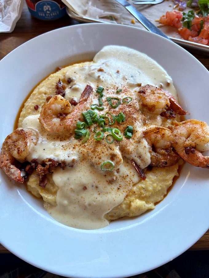 Shrimp and grits elevated to an art form – creamy, savory perfection that would make any Southern grandmother nod in approval.