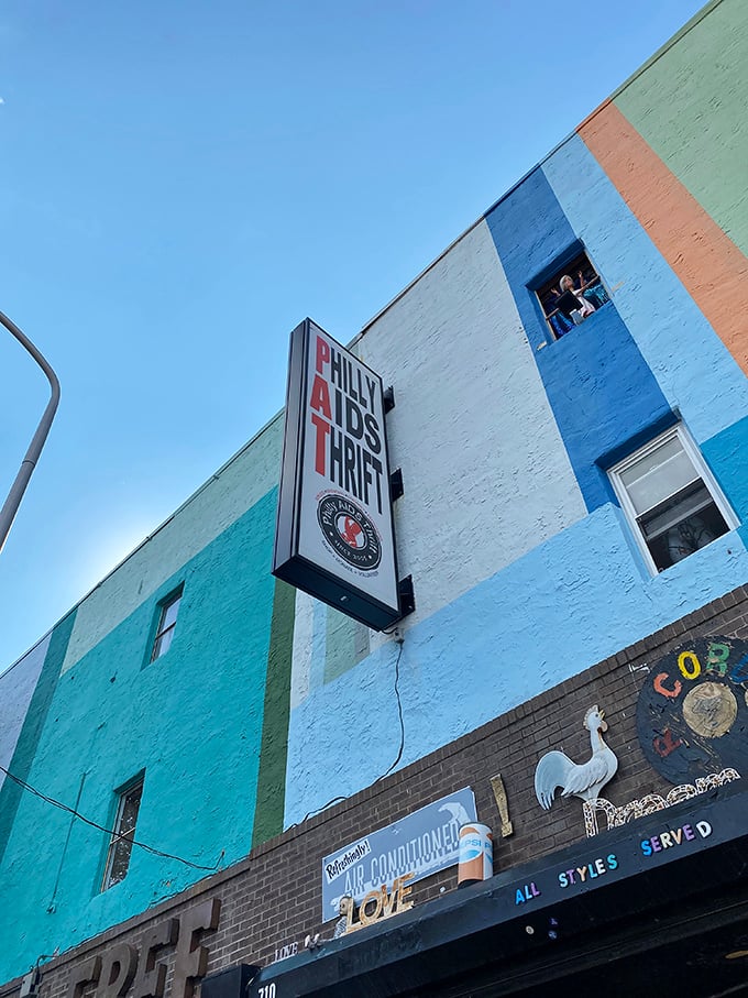 The iconic sign stands tall against Philadelphia's blue sky, a colorful landmark that represents both retail therapy and actual therapy for the community.