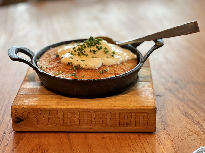 Cornbread that arrives sizzling in its own skillet—the South's answer to "how do we make bread even better?"