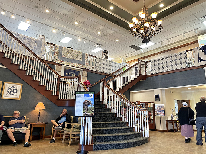 The grand staircase isn't just functional—it's a promise of more treasures upstairs, like Willy Wonka's factory but with quilts instead of Oompa Loompas.