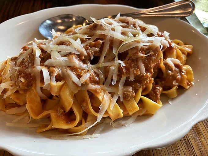 Tagliatelle Bolognese that doesn't hide behind excess sauce – just perfect pasta ribbons embracing a rich meat sauce in culinary harmony.