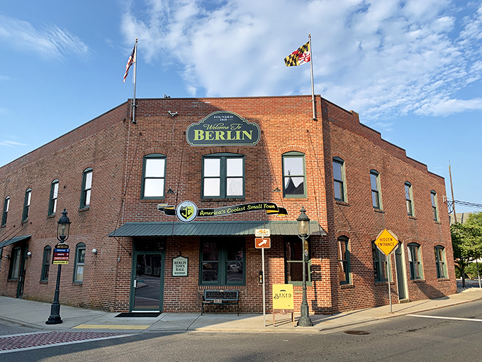 Not just a town hall—a statement piece. Berlin announces itself with brick-and-mortar confidence and a Maryland flag snapping in the breeze.