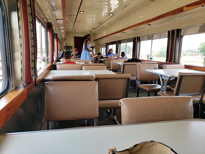 Fellow adventurers enjoy the spacious dining car, where conversations flow as freely as the Florida landscape outside the windows.