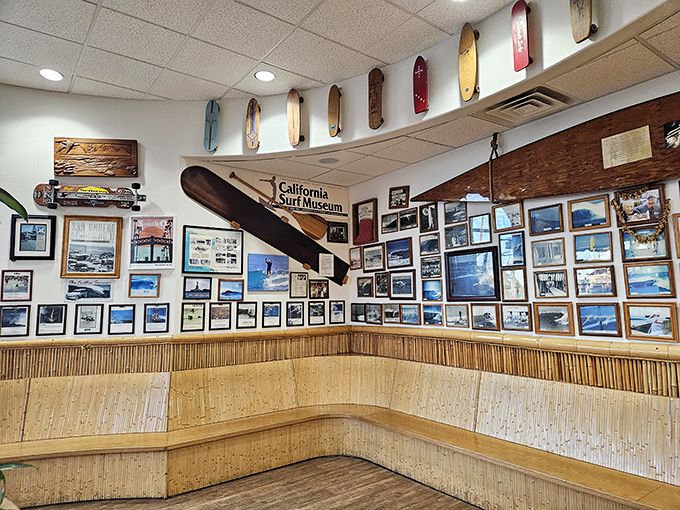 Not just decoration—this wall tells stories of legendary waves, epic wipeouts, and the California surf culture that flavors everything here.