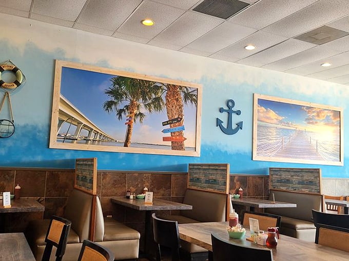Ocean blues and maritime treasures transform a simple wall into a coastal getaway—breakfast with a side of vacation vibes.