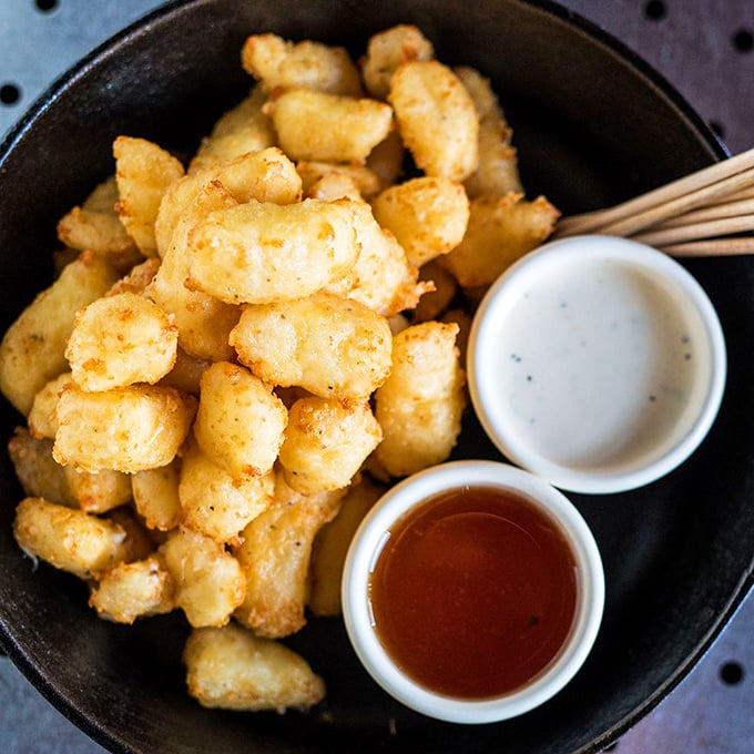 Wisconsin cheese curds that have clearly found their California calling. Crispy outside, gooey inside—like the best of us.