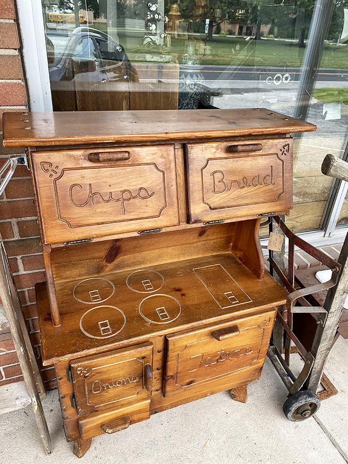 Not just a child's play kitchen—this wooden pantry cabinet once taught little hands about organization before Marie Kondo was even a twinkle in her mother's eye.