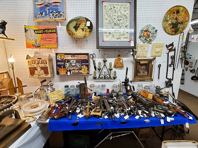 Tools that built America spread across blue cloth – each hammer and wrench holding the fingerprints of craftsmen long gone.