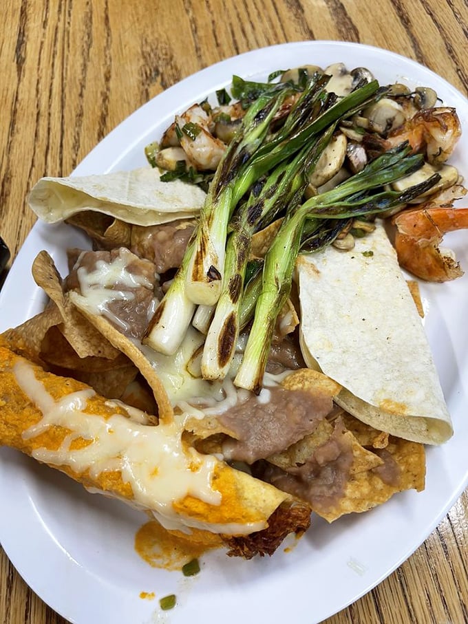 This isn't just a plate—it's a fiesta of textures and flavors where grilled green onions and tortillas dance together in perfect harmony.