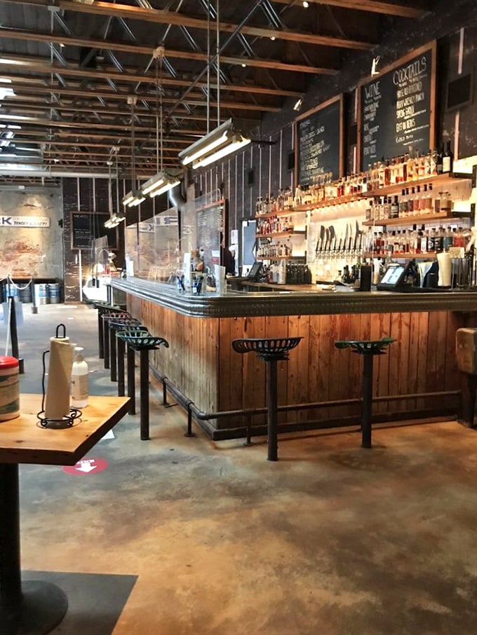 Not just any bar—a whiskey sanctuary with enough amber bottles to make a prohibition agent faint. The perfect liquid companion to smoked perfection.