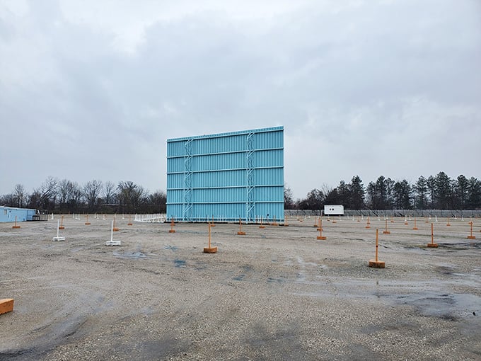 The back of the big screen – cinema's backstage. This aqua-colored giant stands sentinel in the off-season, waiting for summer stories to tell.