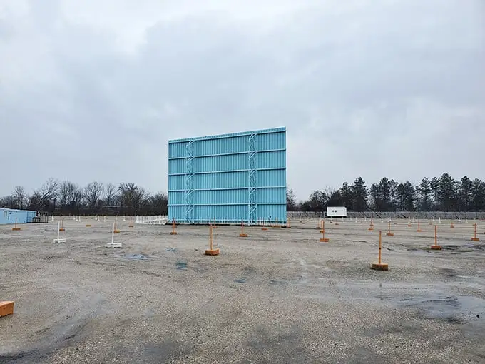 The back of the big screen – cinema's backstage. This aqua-colored giant stands sentinel in the off-season, waiting for summer stories to tell.