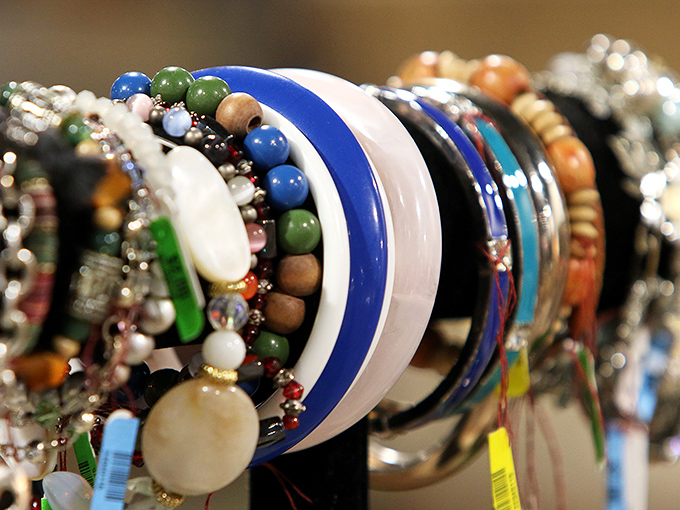 Jewelry that spans decades and styles lines up like colorful soldiers. That blue bangle might have danced at a 1980s wedding or accompanied a first date.