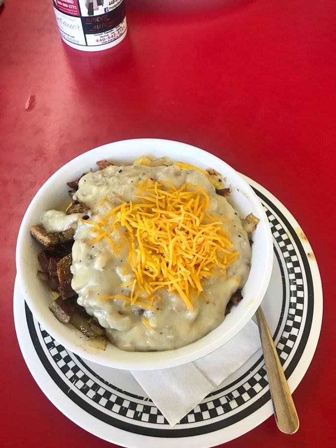 The breakfast bowl – where sausage gravy and cheddar create a magnificent summit atop a mountain of morning favorites.