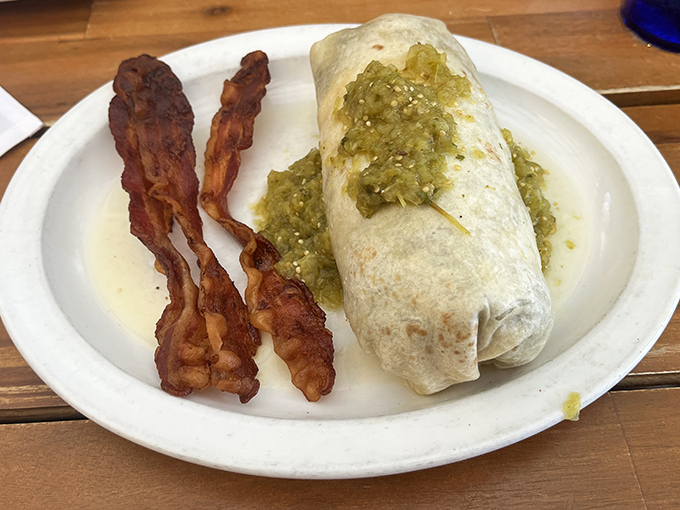 This breakfast burrito with crispy bacon isn't just a meal—it's a hand-held festival of flavors wrapped in a warm tortilla hug.