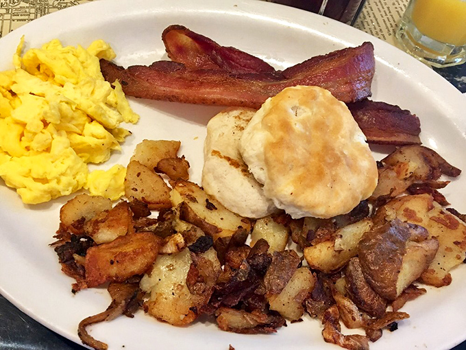 The classic breakfast platter – where eggs, bacon, homefries and biscuit gather like old friends for their daily meeting on the perfect white plate.
