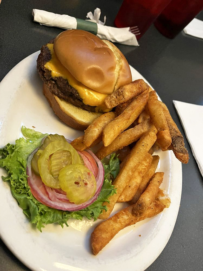 This isn't just a cheeseburger—it's therapy on a plate. The pickle chips add that perfect vinegary counterpoint to the richness