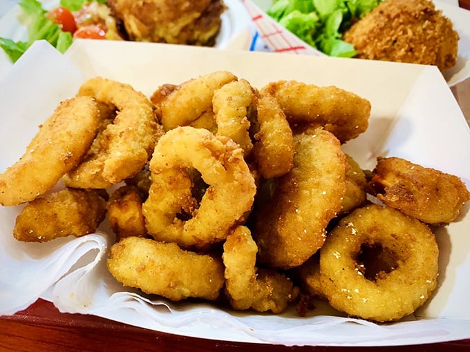 Golden-fried calamari that shatters with each bite. This isn't rubbery bar food—it's the tender, crispy seafood that makes you wonder why you order it anywhere else.