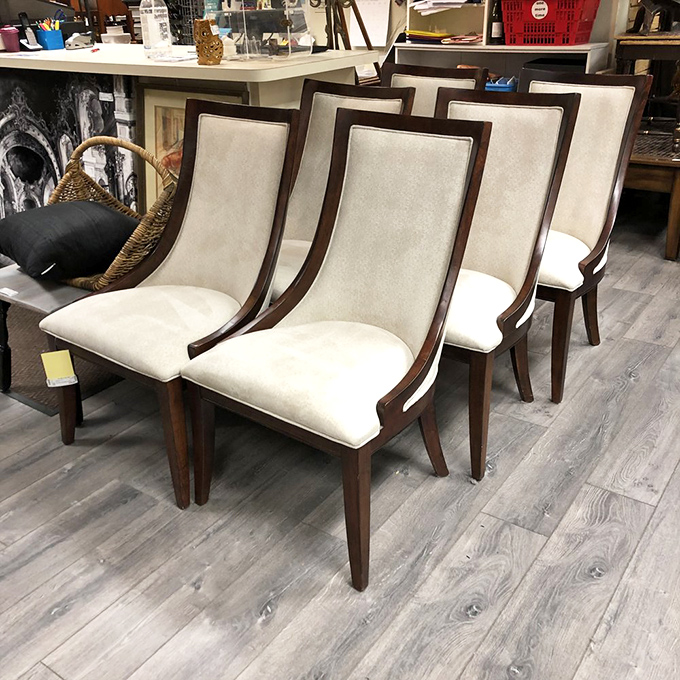 These elegant dining chairs with their cream upholstery and dark wood frames are waiting for their next dinner party. Sophisticated without trying too hard—like Audrey Hepburn in chair form.