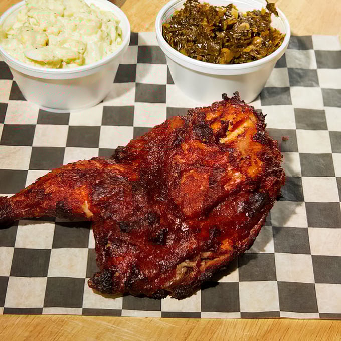 Half a chicken wearing its smoky coat like a badge of honor, ready to make you forget about portion control.