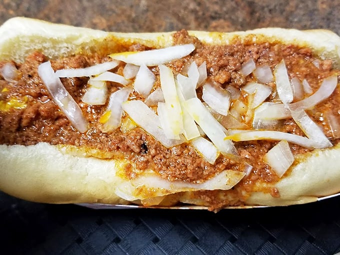 The chili dog—where beef meets more beef in a relationship so perfect it should have its own romance novel. Those diced onions add just the right crunch.