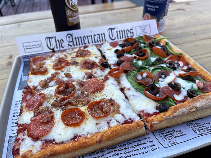 Two personalities sharing one box—like the odd couple of pizza. The left side's pepperoni simplicity balances the right side's veggie exuberance.